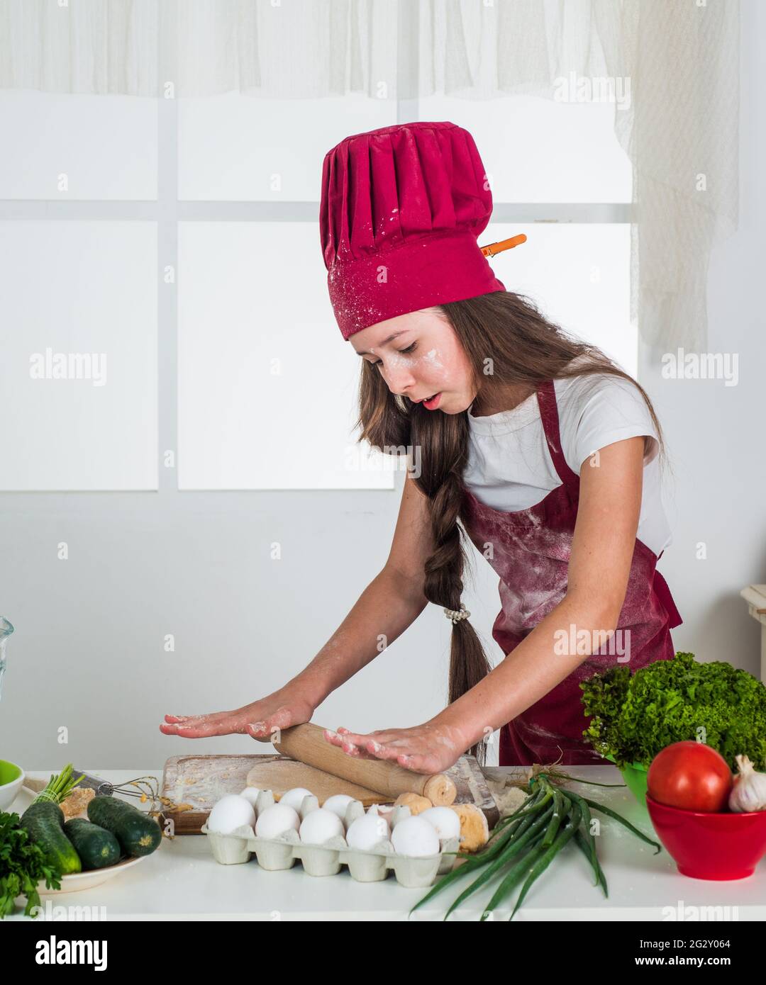 child girl cooking meal from healthy and organic products only, health ...