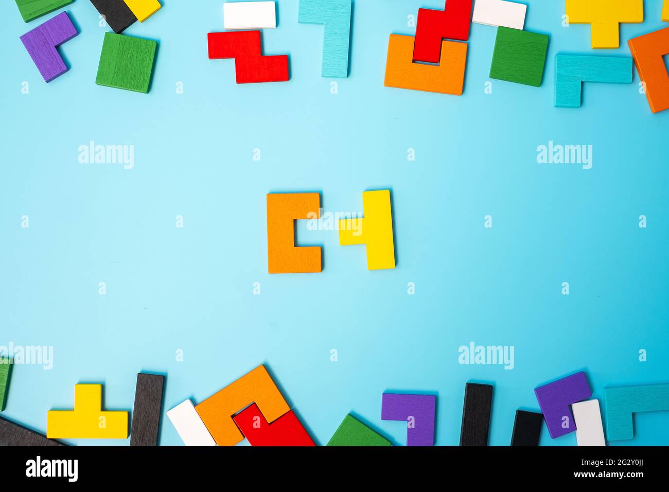 colorful wood puzzle pieces on blue background, geometric shape block ...