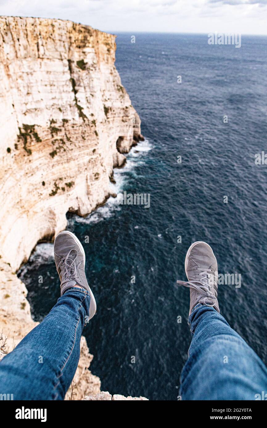 Legs dangling wall hi-res stock photography and images - Alamy