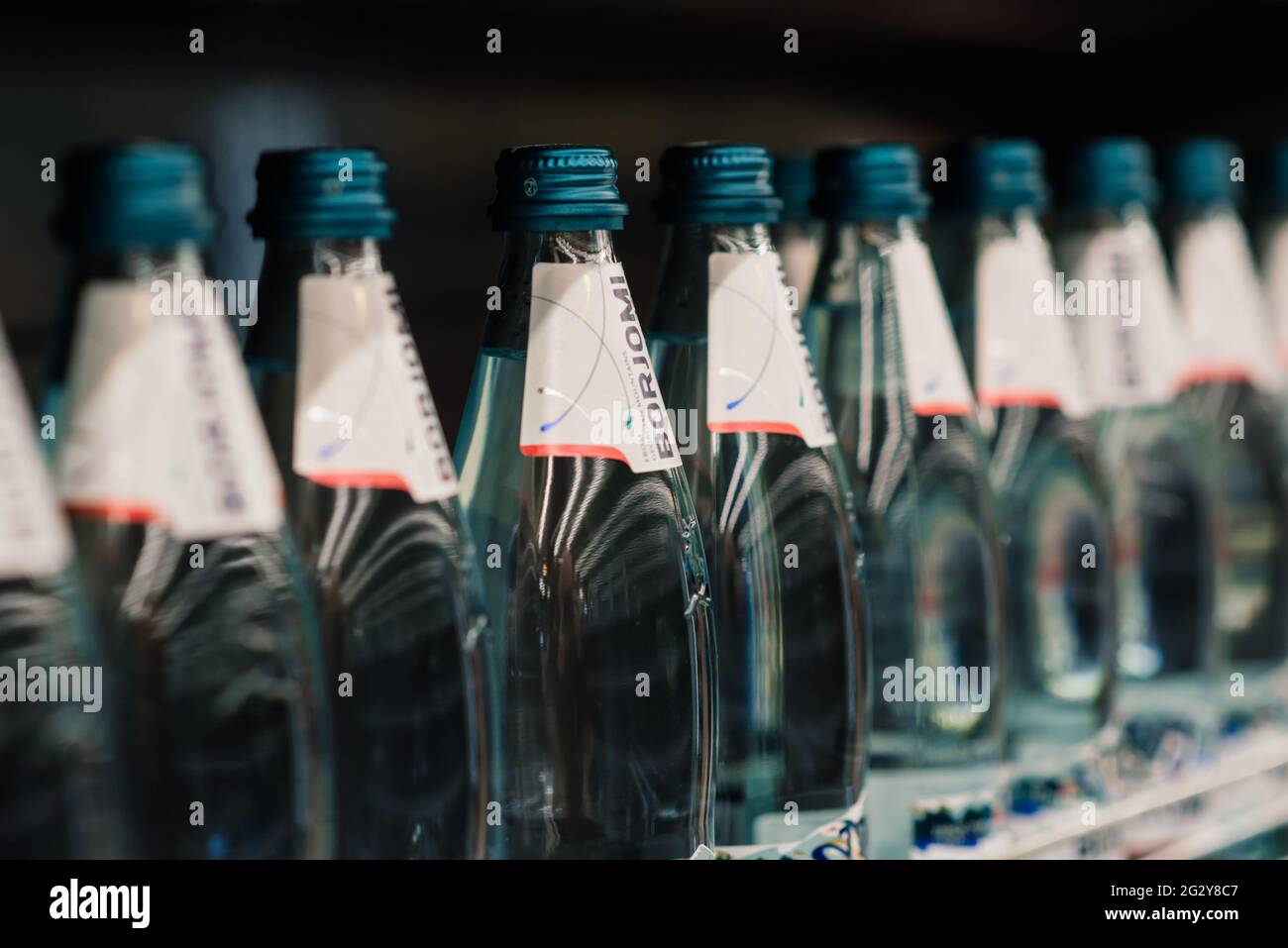Few drinking mineral water bottles on shelf left in department store ...