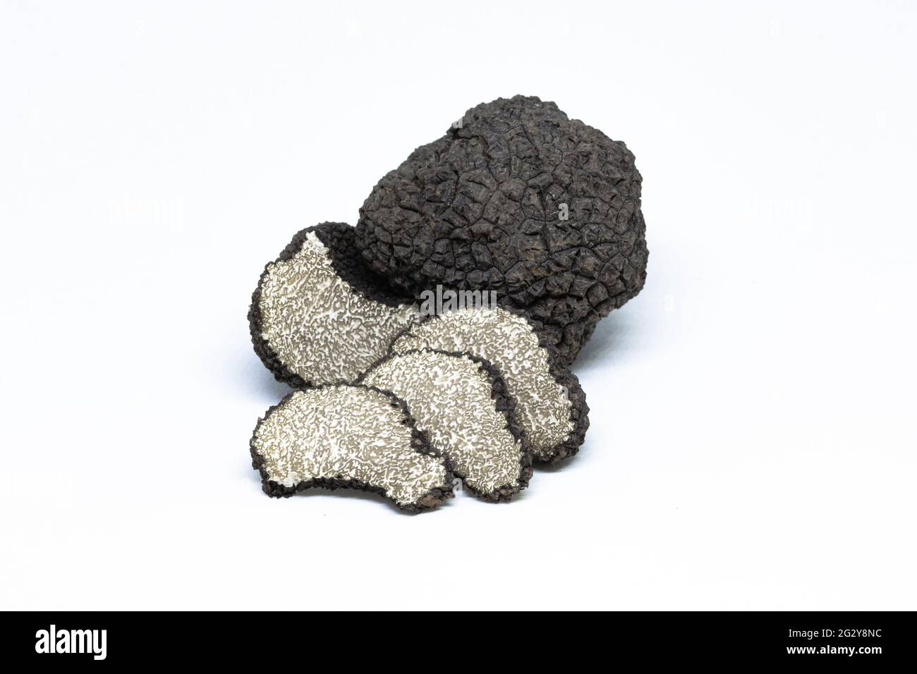 black truffle, tuber aestivum, cut, slice, open, photographed on a ...