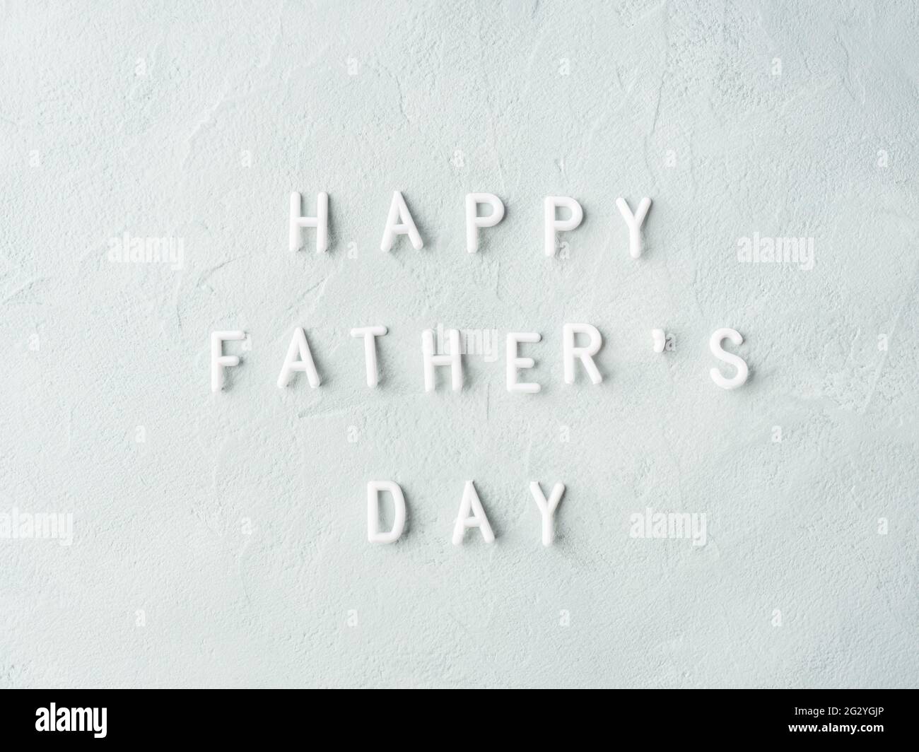 Happy fathers day letters text greeting card on gray stone background ...