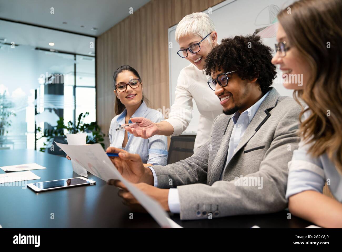 Happy business people having fun and chatting at workplace office Stock ...