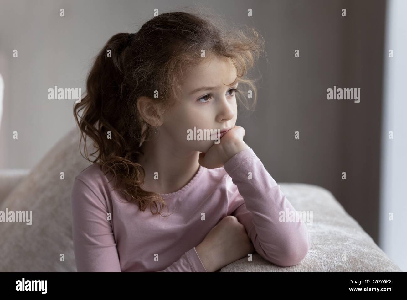 Sad teen ethnic girl look in distance thinking Stock Photo - Alamy