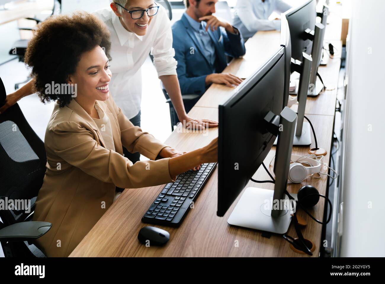 Happy business people having fun and chatting at workplace office Stock ...