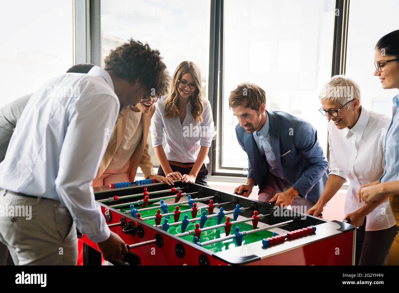 Employees playing table football hi-res stock photography and images ...
