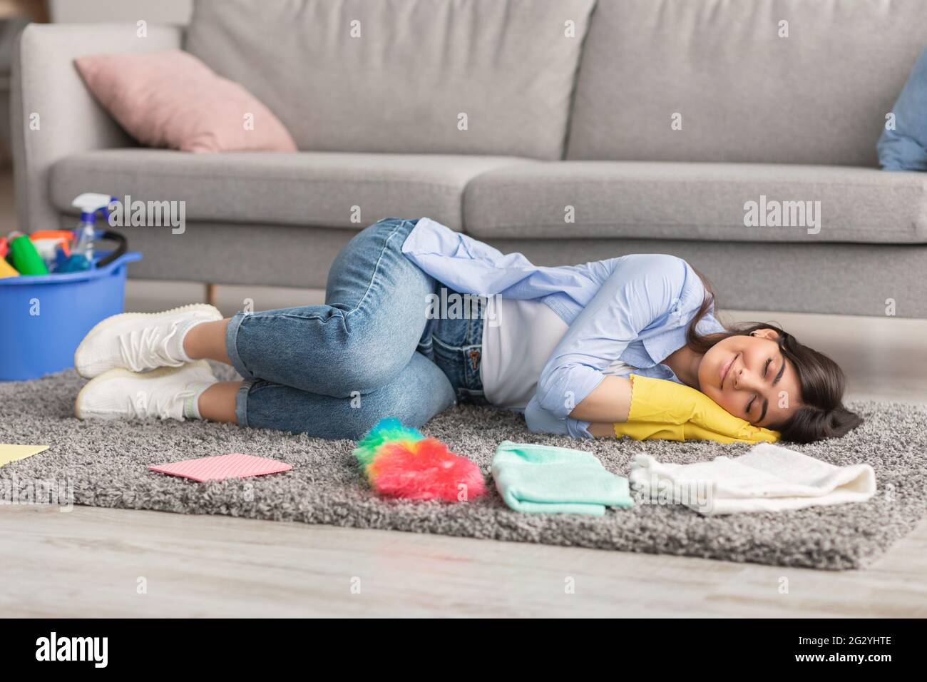 Tired woman lying on floor carpet and sleeping Stock Photo - Alamy