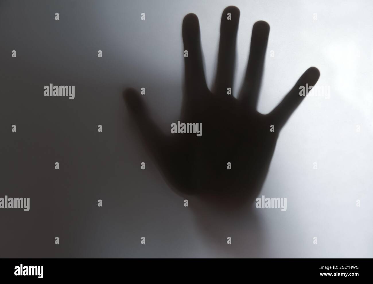 Reflection of shadows of children hands on frosted glass, blur Stock ...