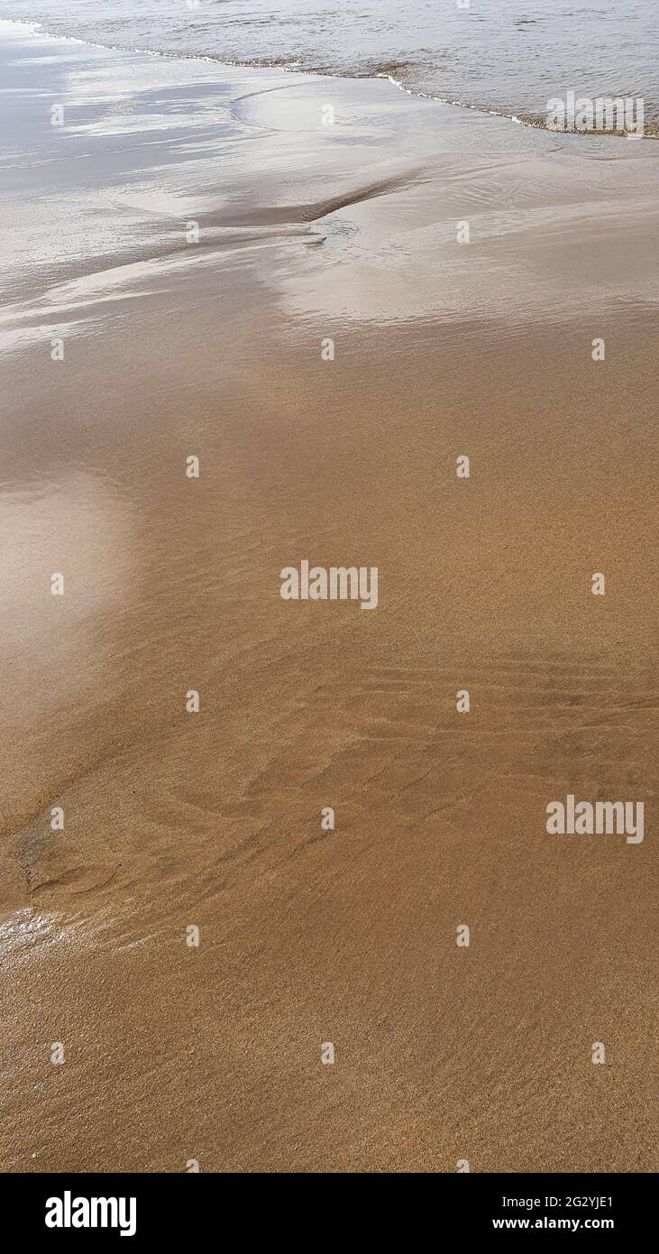 Sand and water: patterns and lines in sand created by the and water ...