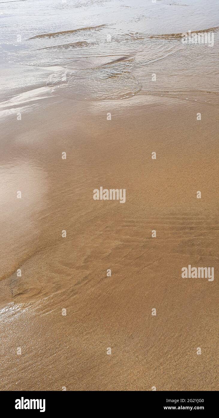 Sand and water: patterns and lines in sand created by the and water ...