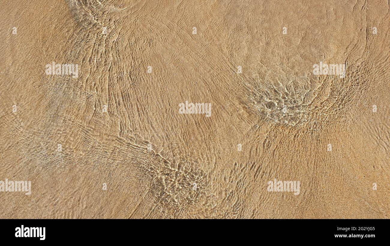 Sand and water: patterns and lines in sand created by the and water ...