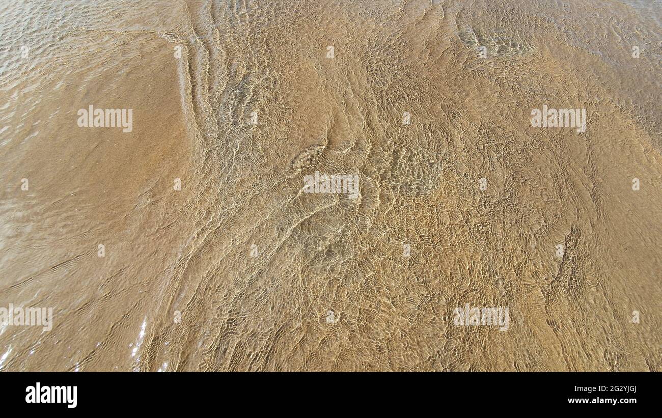Sand and water: patterns and lines in sand created by the and water ...
