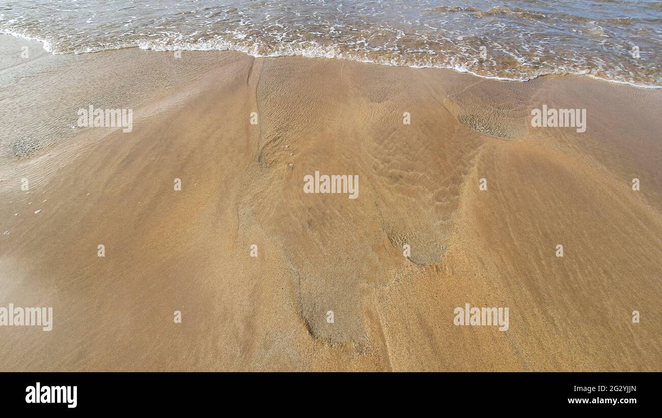Sand and water: patterns and lines in sand created by the and water ...