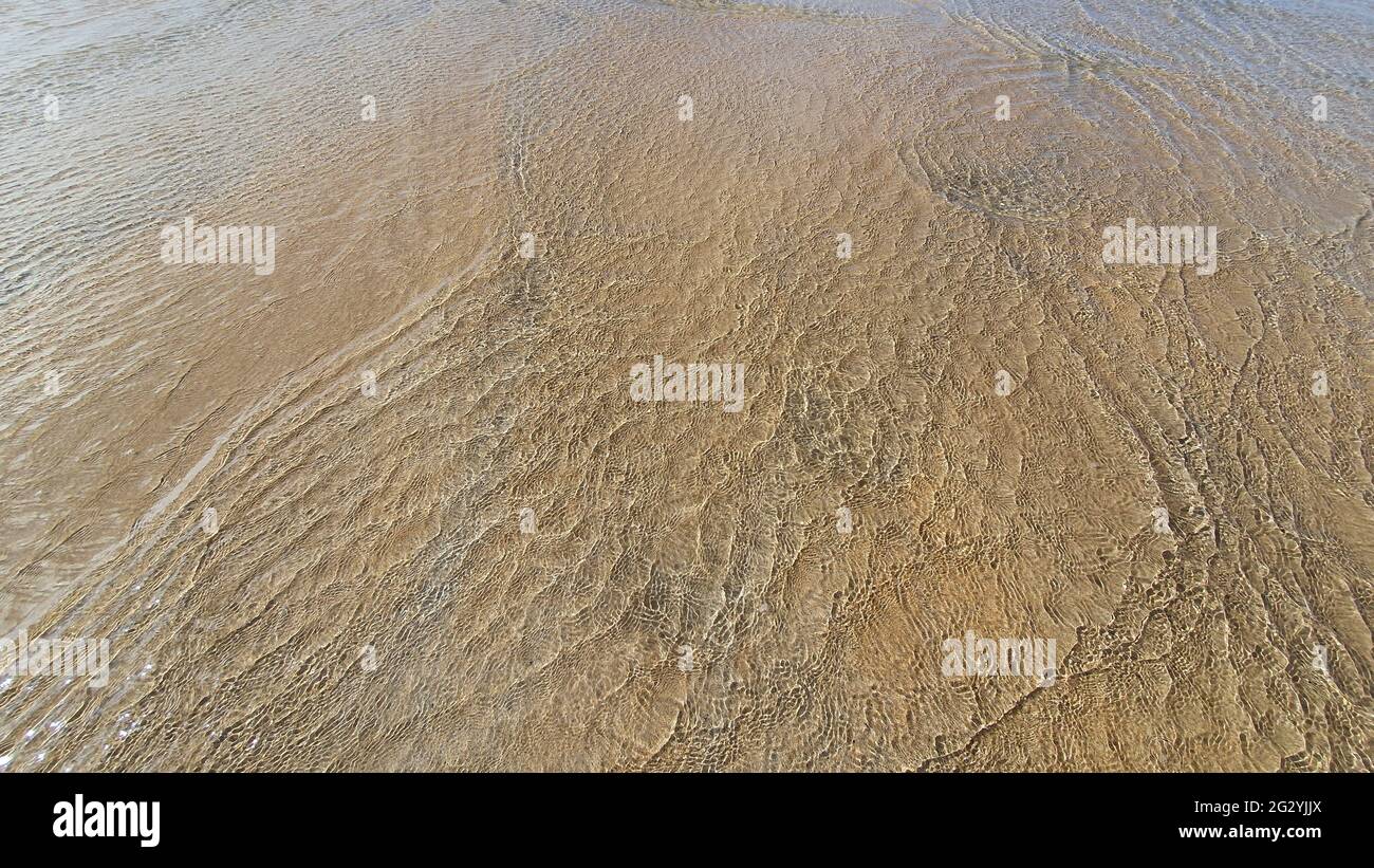 Sand and water: patterns and lines in sand created by the and water ...