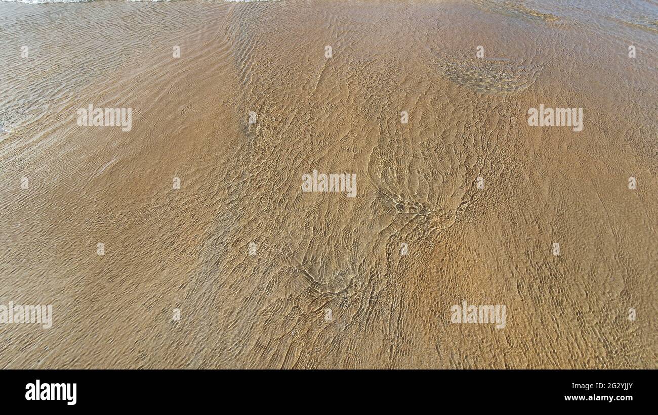 Sand and water: patterns and lines in sand created by the and water ...