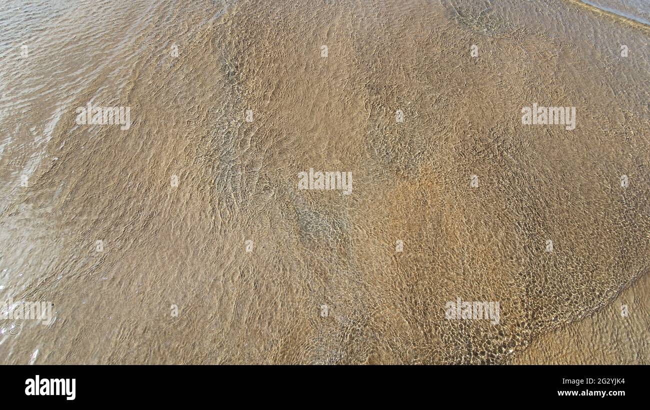 Sand and water: patterns and lines in sand created by the and water ...