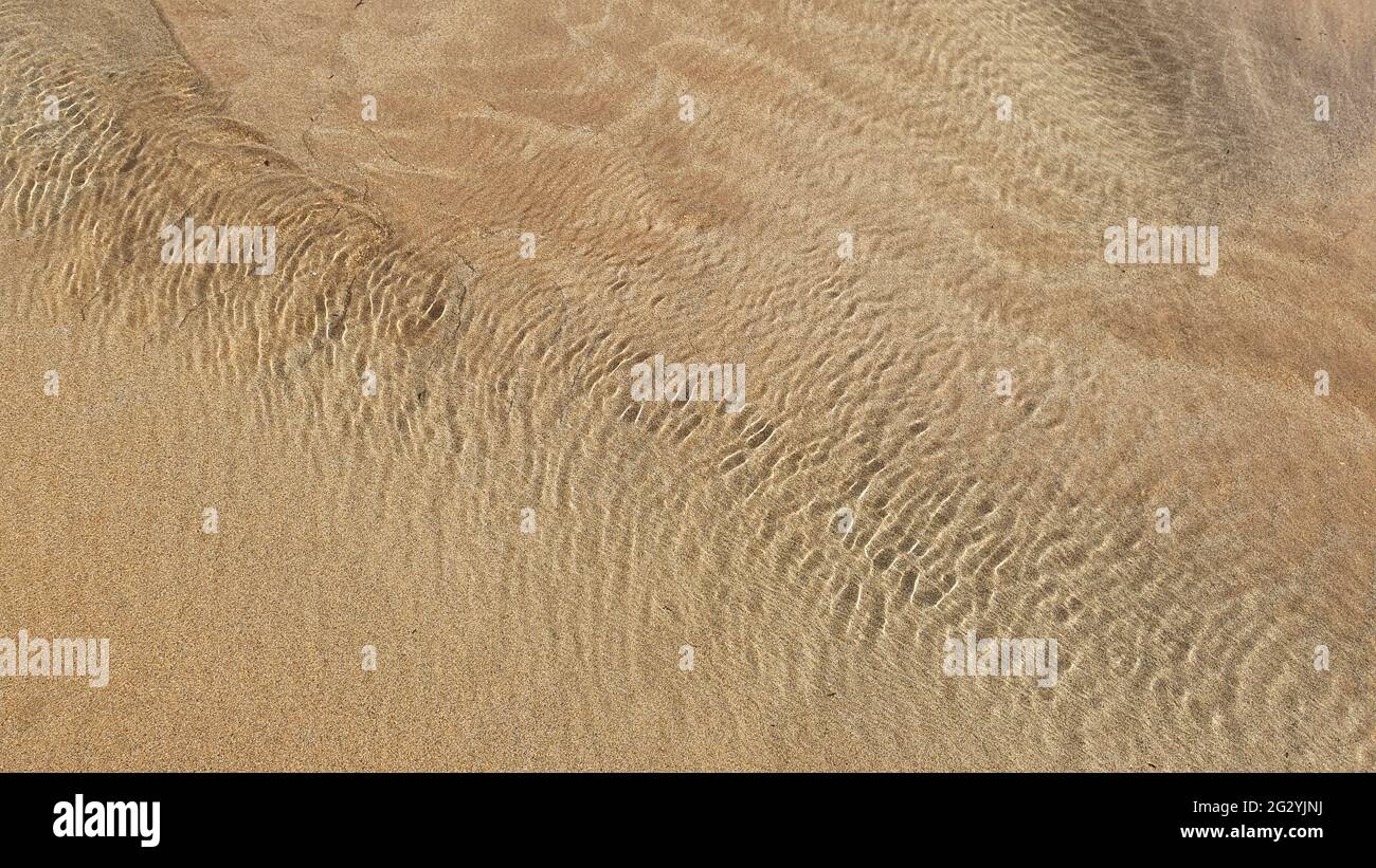 Sand and water: patterns and lines in sand created by the and water ...