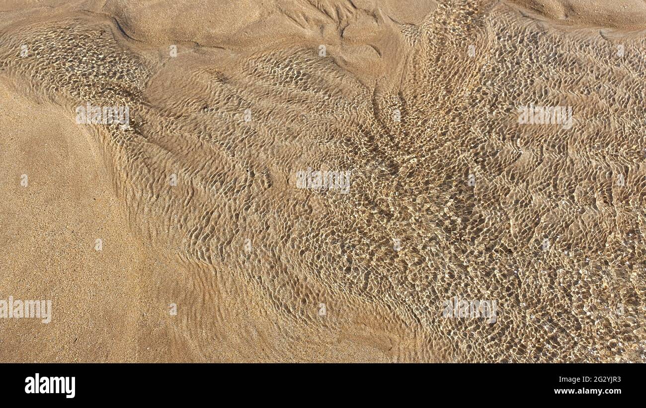 Sand and water: patterns and lines in sand created by the and water ...