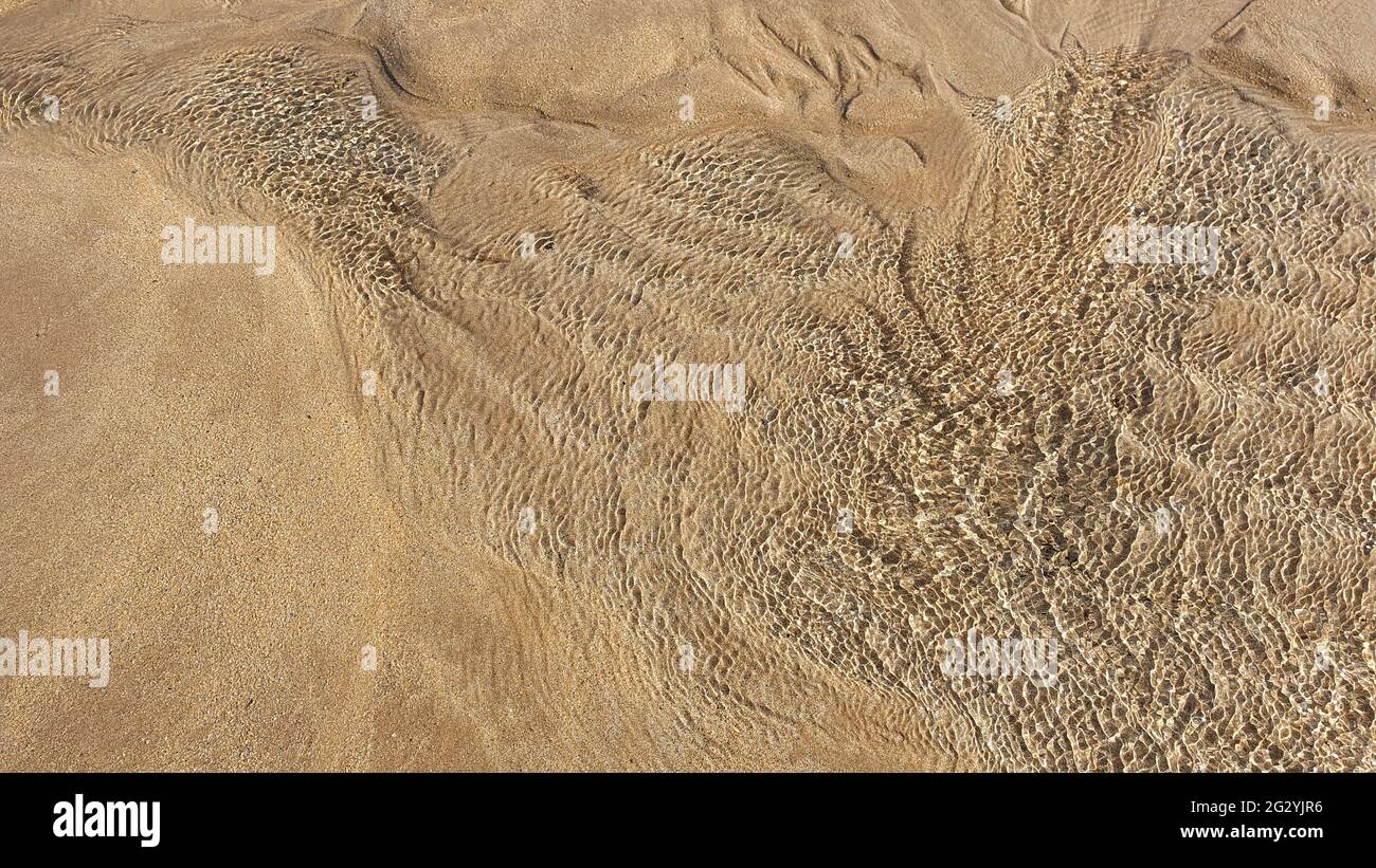 Sand and water: patterns and lines in sand created by the and water ...