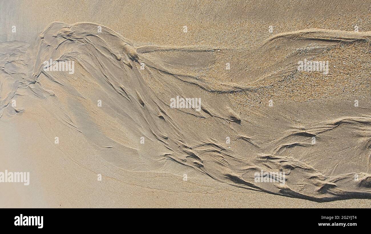 Sand and water: patterns and lines in sand created by the and water ...
