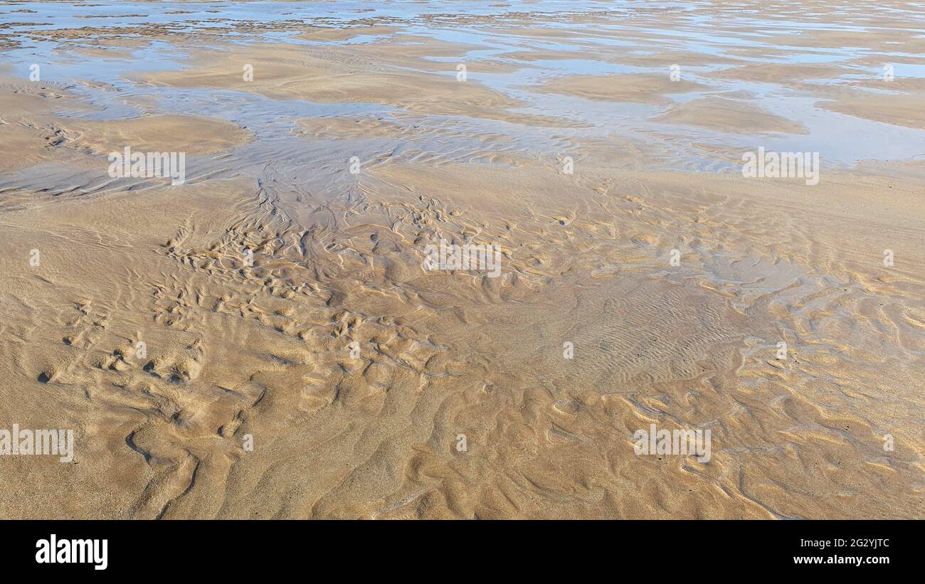 Sand and water: patterns and lines in sand created by the and water ...