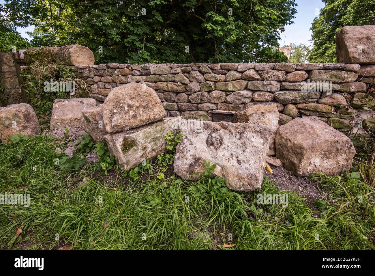 Damage to churchyard wall hi-res stock photography and images - Alamy