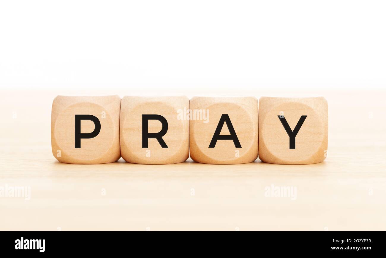 Pray word on wooden blocks. White background. Copy space Stock Photo ...