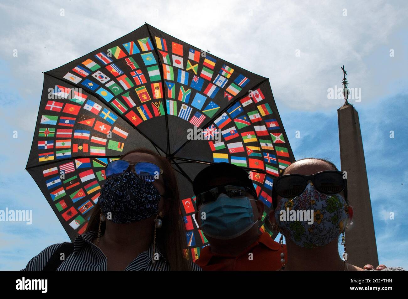 Vatican. 13th June, 2021. June 13, 2021 : People stand under umbrella ...