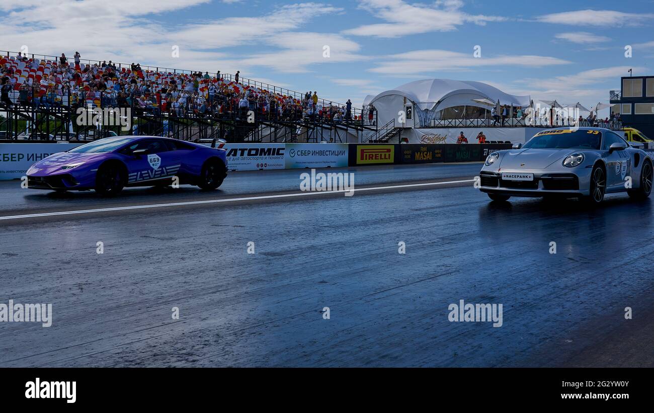 Moscow, Russia. 05th June, 2021. A gray Porsche 911 and a purple ...