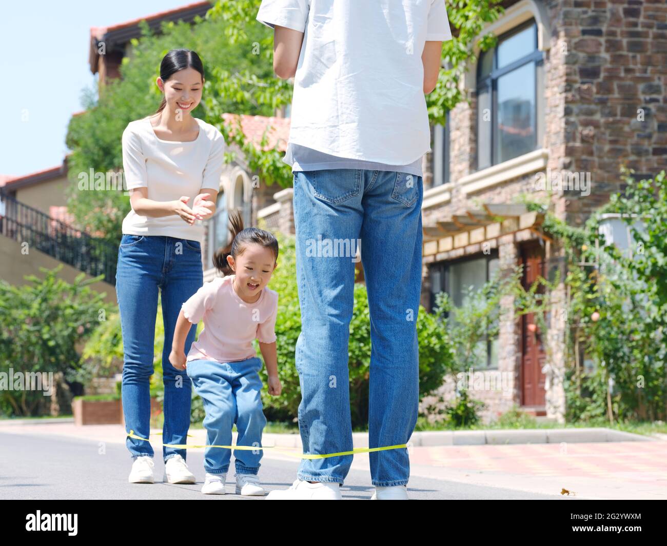 Daughter jumping rope mother hi-res stock photography and images - Alamy