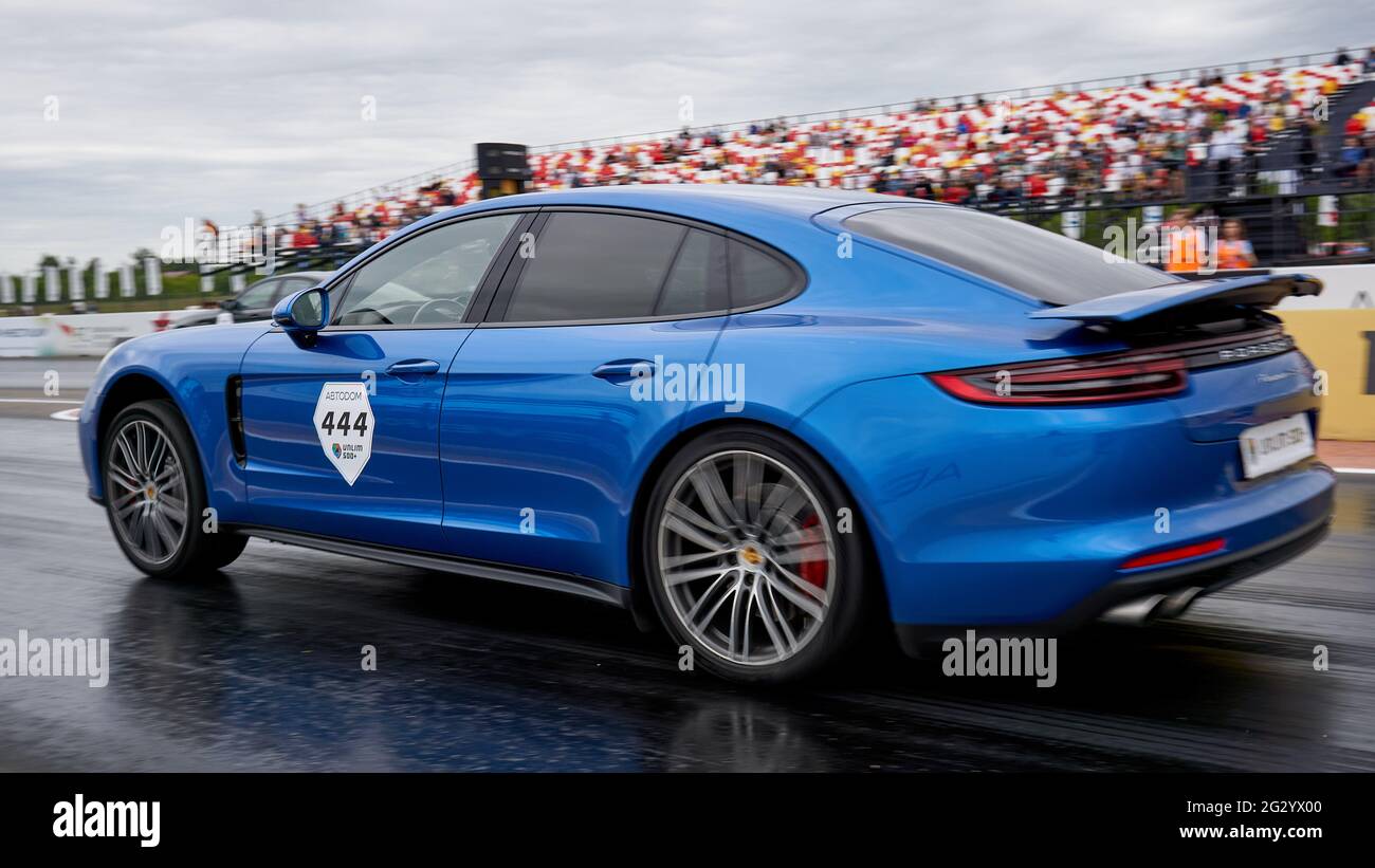 Moscow, Russia. 05th June, 2021. A blue Porsche Panamera zips by during ...
