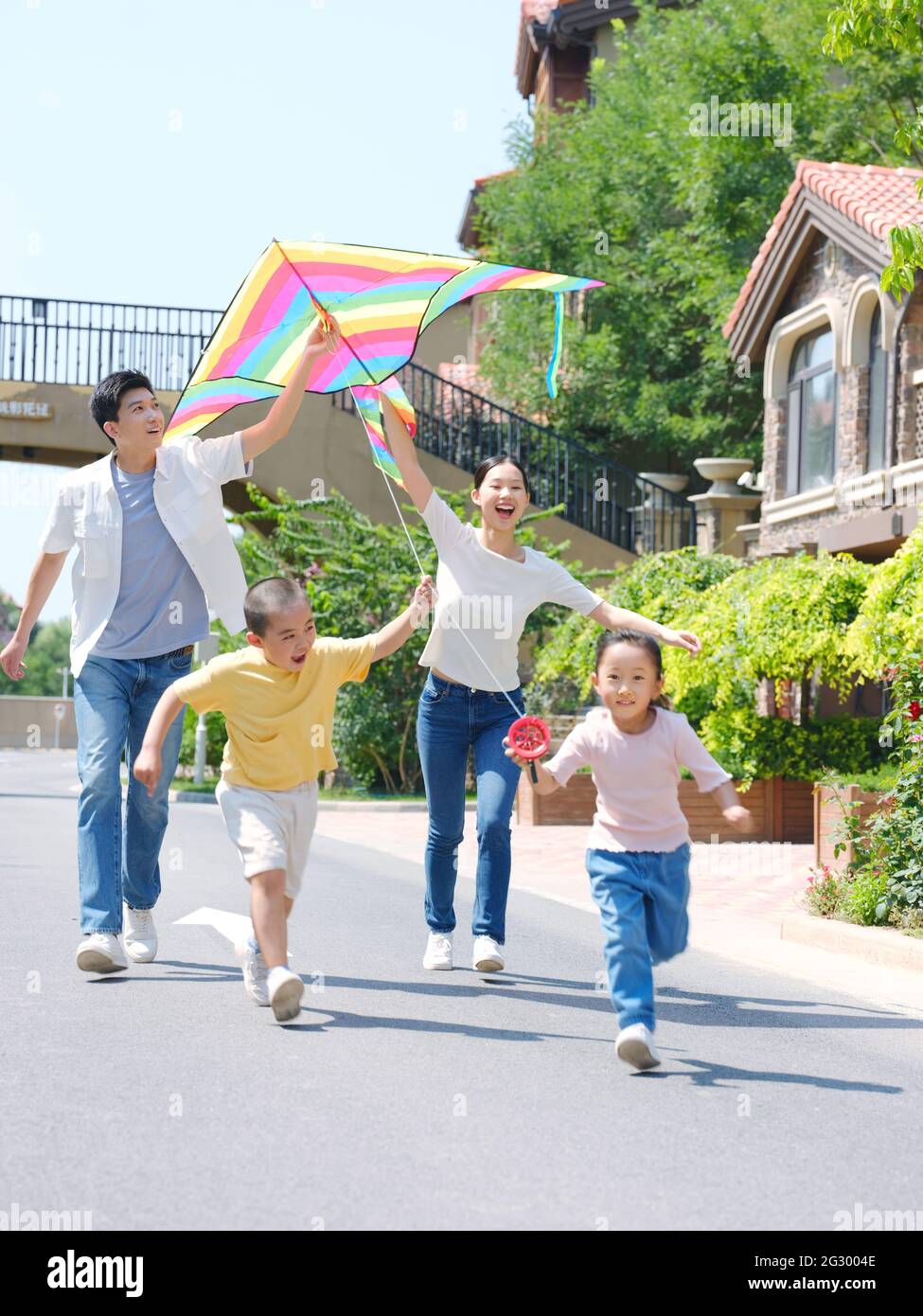 Happy family of four flying kites outdoors high quality photo Stock ...