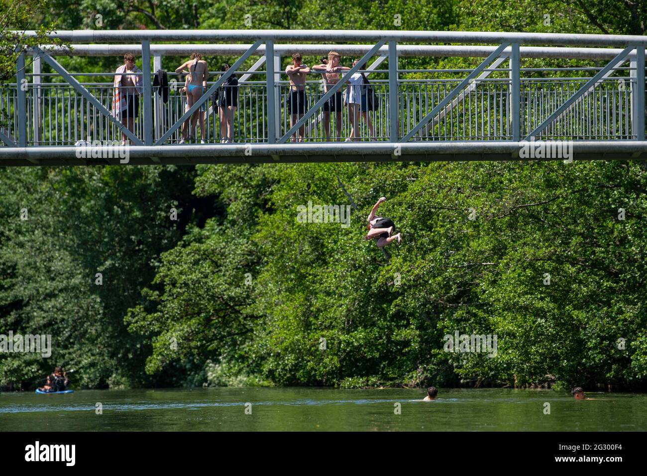 13.06.21. WEATHER, SOMERSET. People jump from a footbridge into the ...