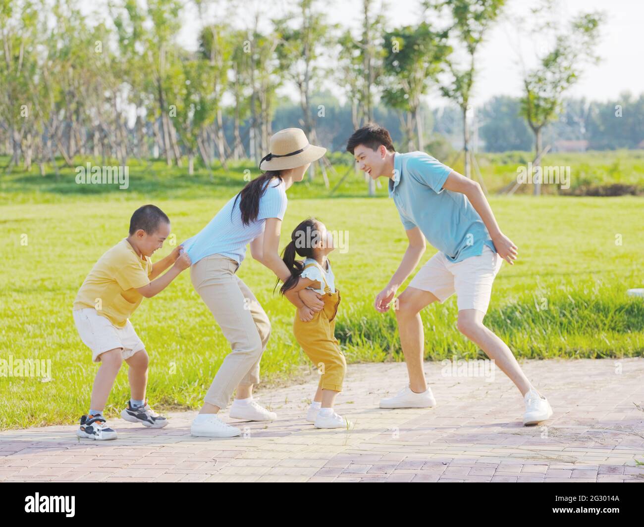 Happy family of four playing games in the park high quality photo Stock ...