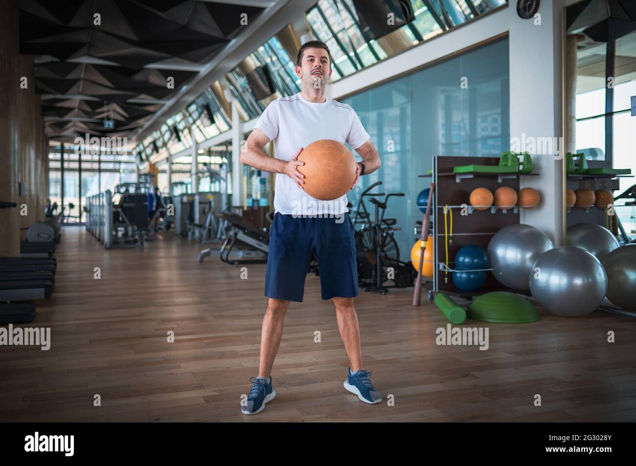 Handsome men exercising in gym hi-res stock photography and images - Alamy