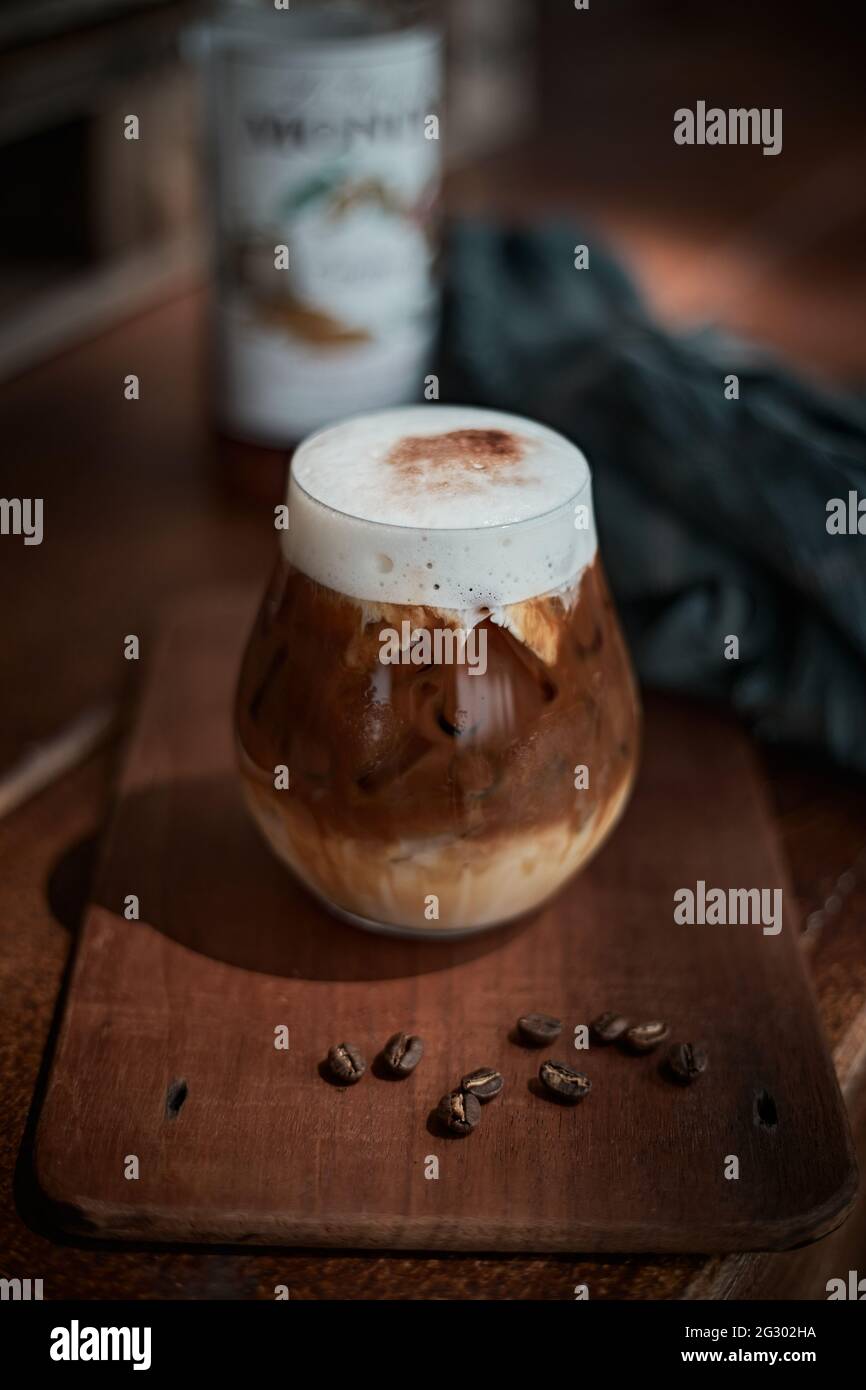 Cafe latte macchiato layered coffee in a see through glass coffee cup ...