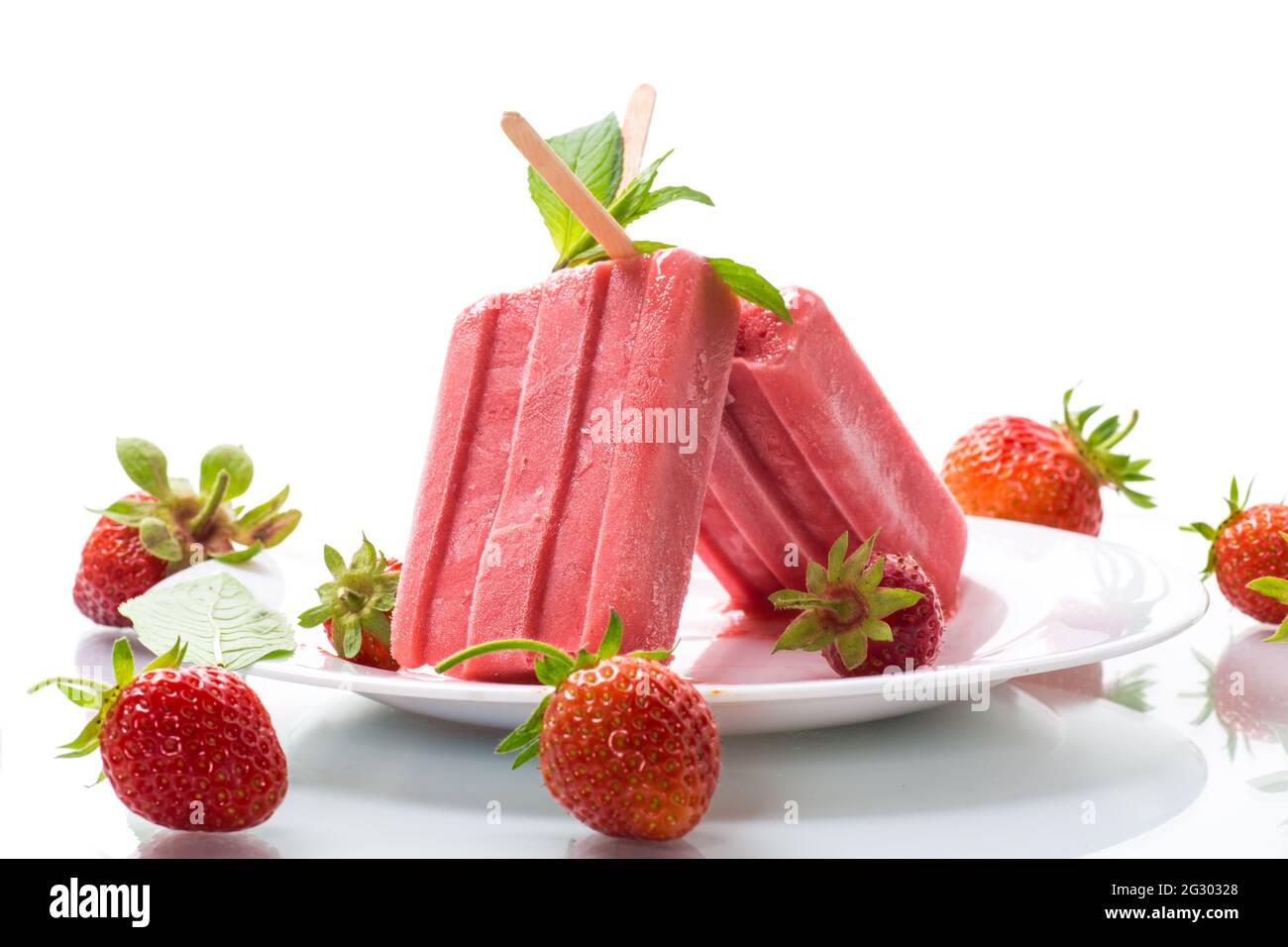 homemade strawberry ice cream on a stick made from fresh strawberries ...