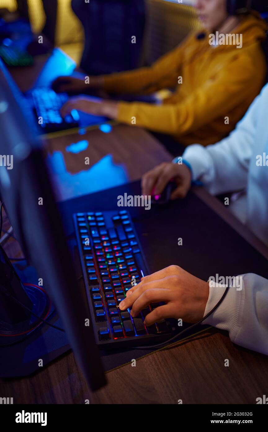 Two young gamers play in game club Stock Photo - Alamy