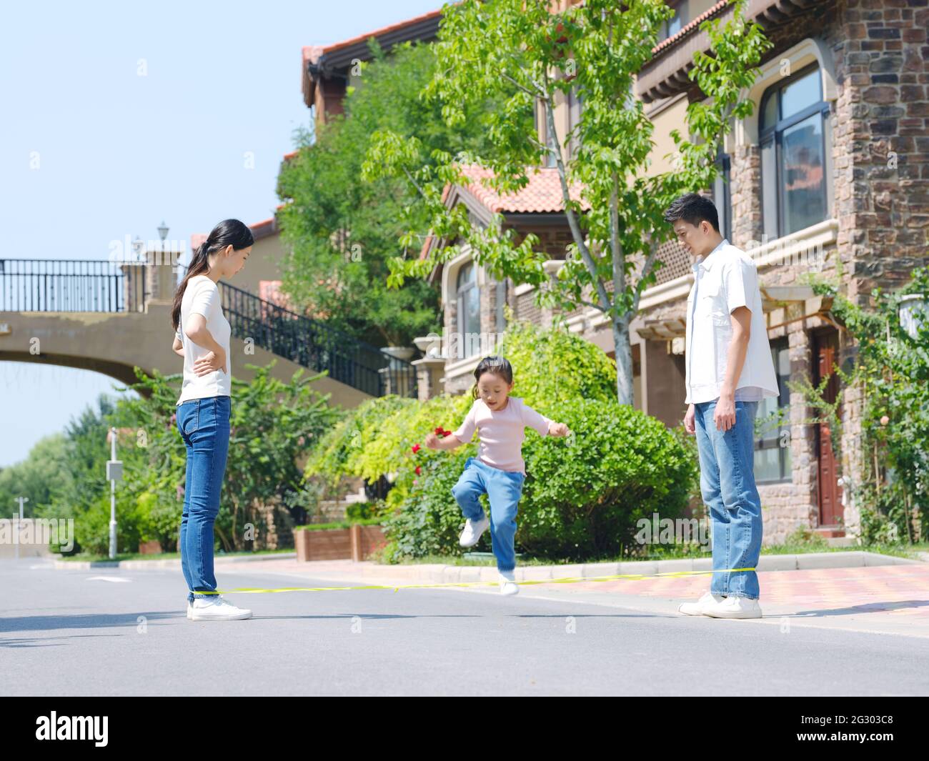 Daughter jumping rope mother hi-res stock photography and images - Alamy