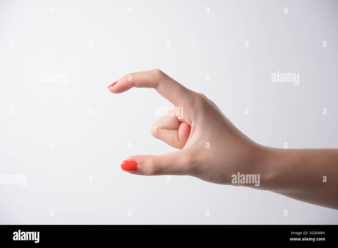 Woman hand sign isolated on white background. Middle size Stock Photo ...