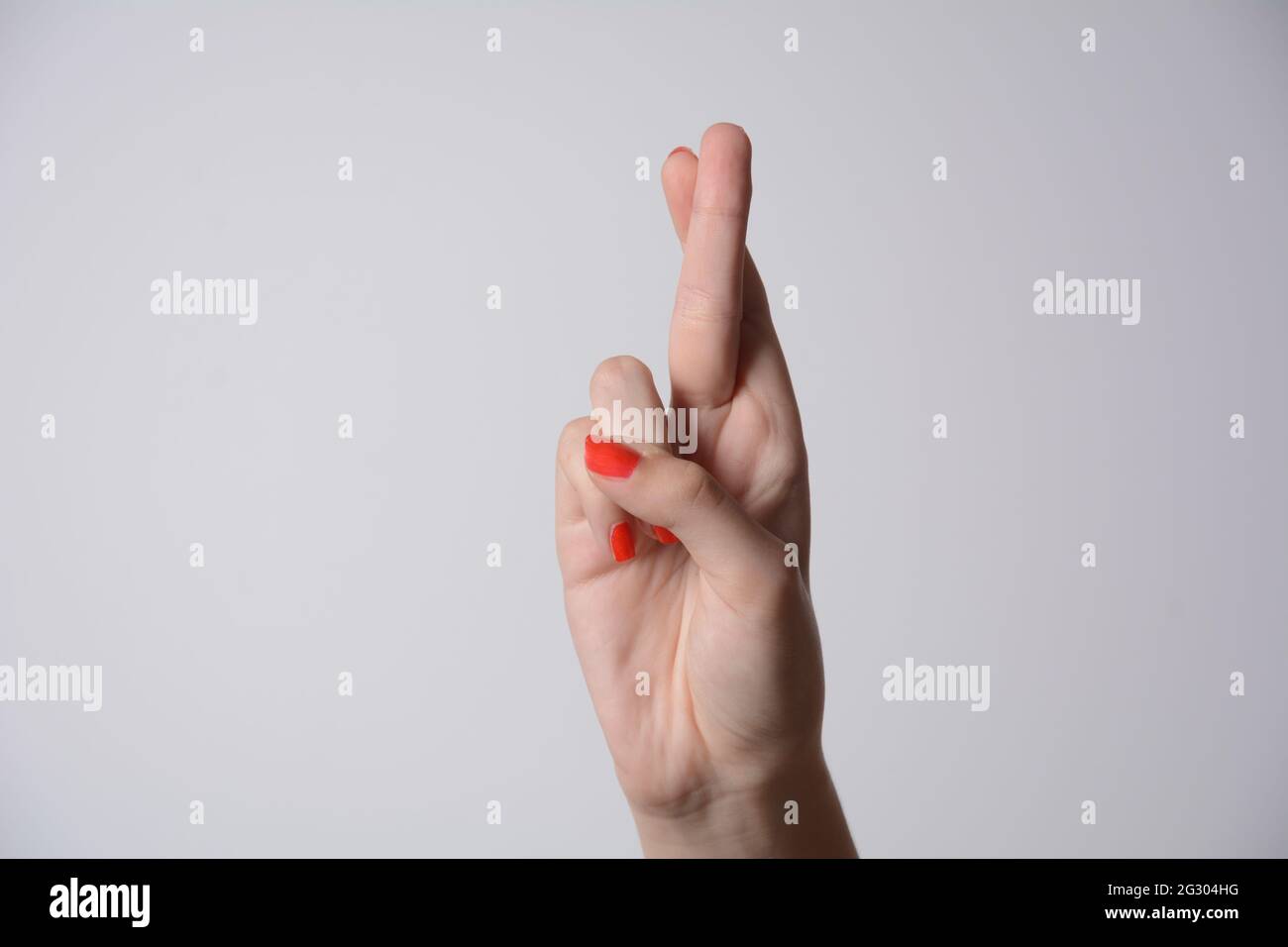 Woman hand show finger cross and lie symbol on white background Stock ...