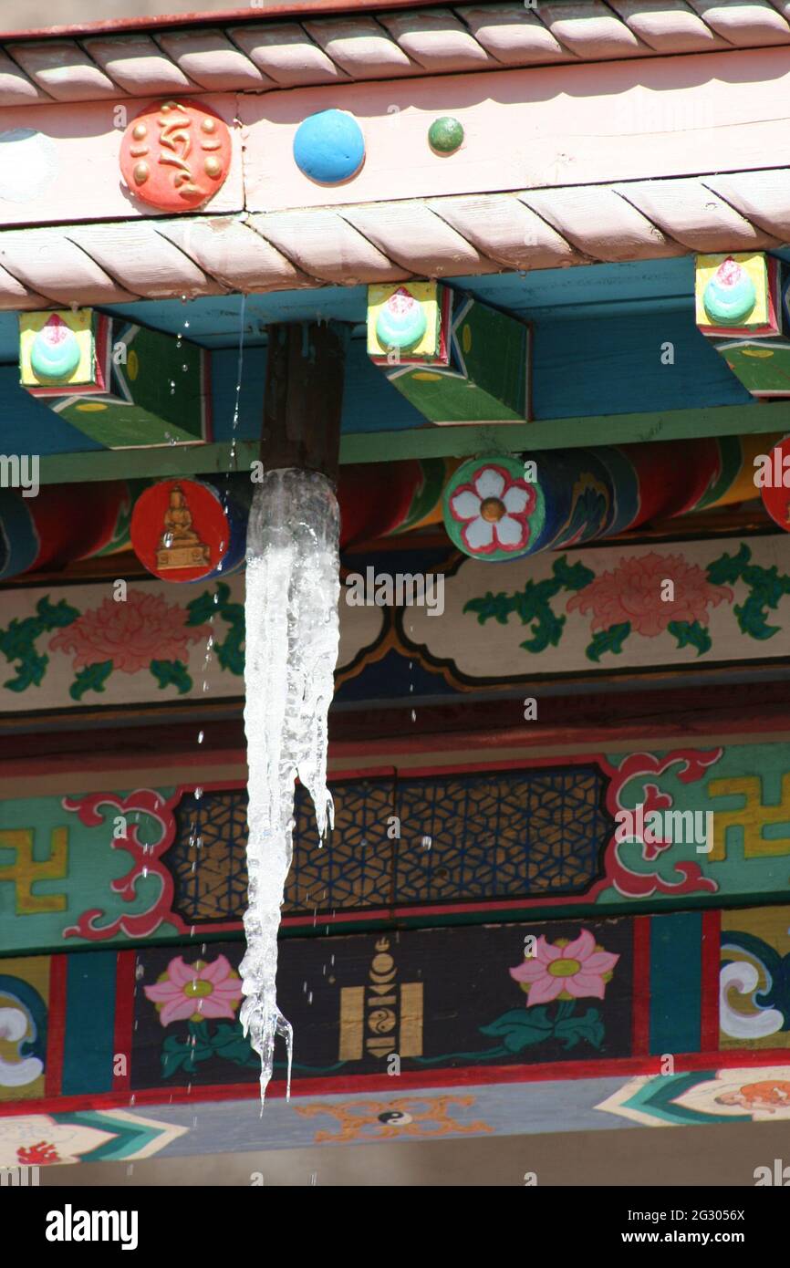 An icicle hanging from the eaves of a remote Buddhist temple in rural ...