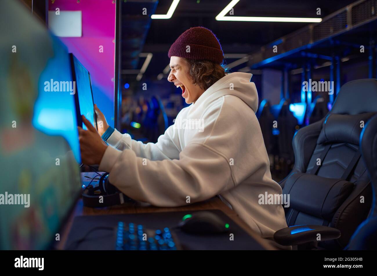 Young gamer won the tournament, gaming club Stock Photo - Alamy