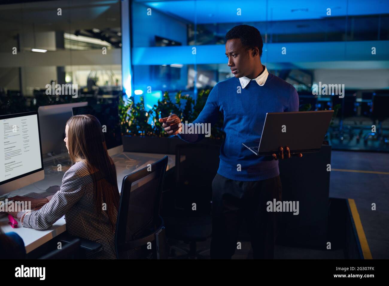 Two managers works in night office Stock Photo - Alamy