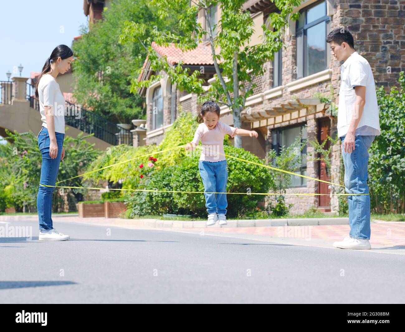 Daughter jumping rope mother hi-res stock photography and images - Alamy