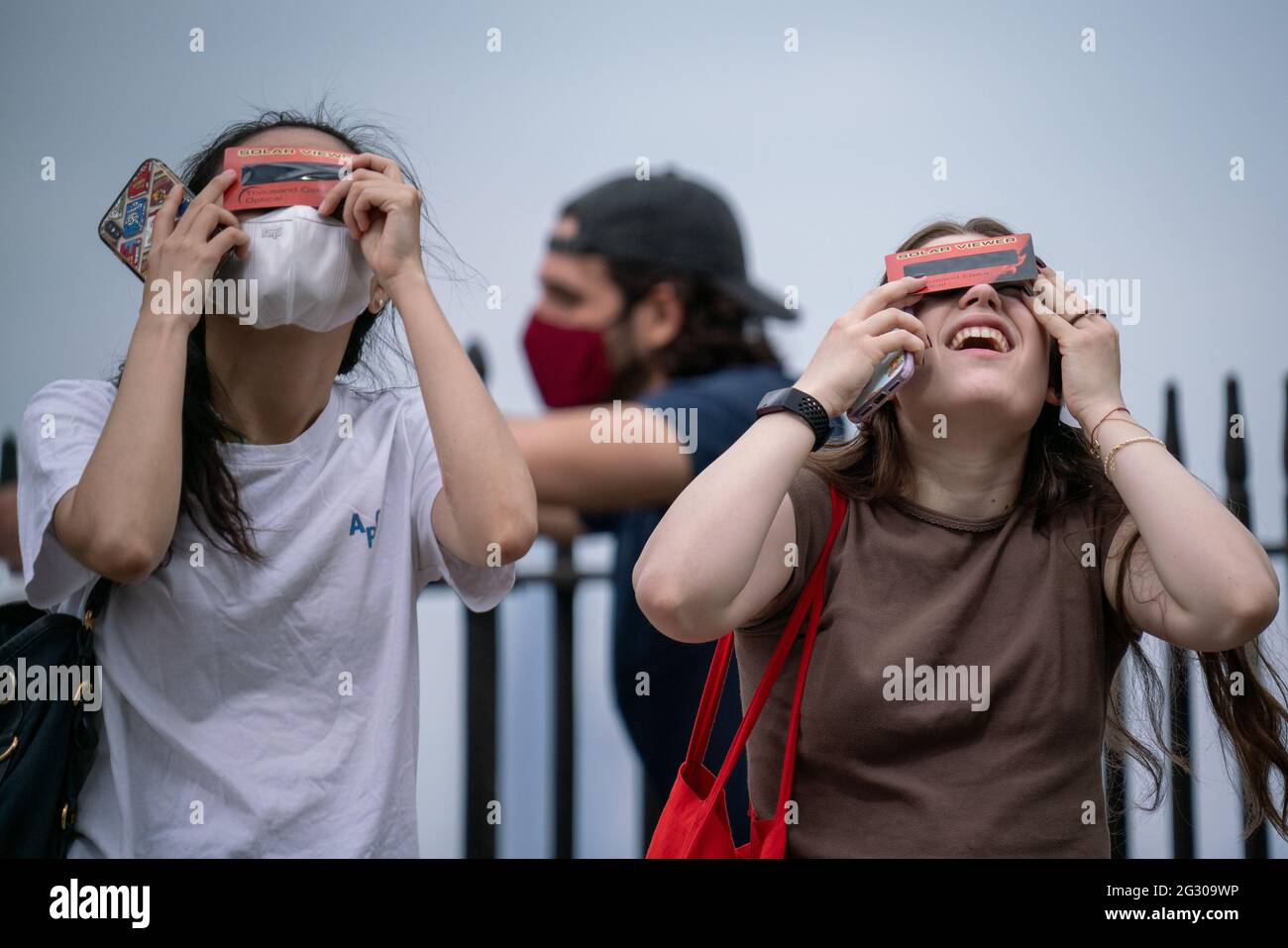 UK Weather: Partial solar eclipse seen from Greenwich Park reaches its ...