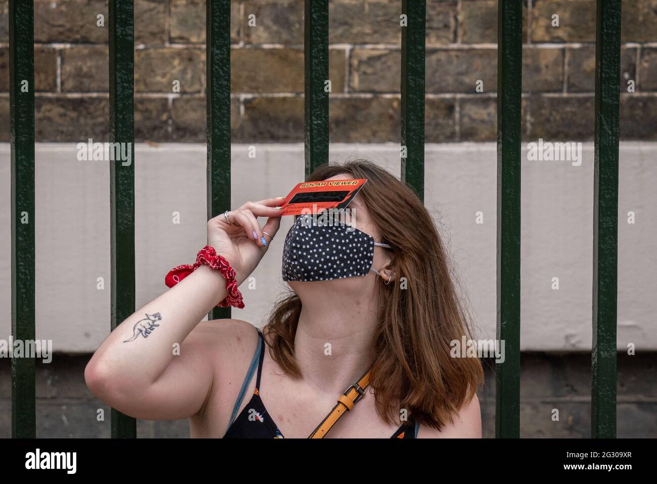 UK Weather: Partial solar eclipse seen from Greenwich Park reaches its ...