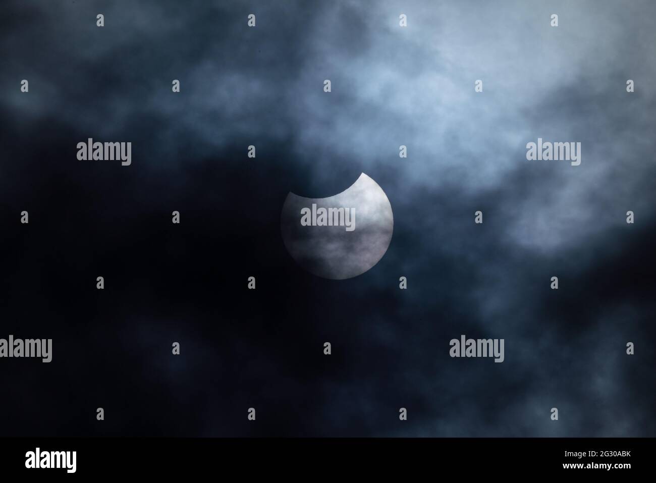 UK Weather: Partial solar eclipse seen from Greenwich Park reaches its ...