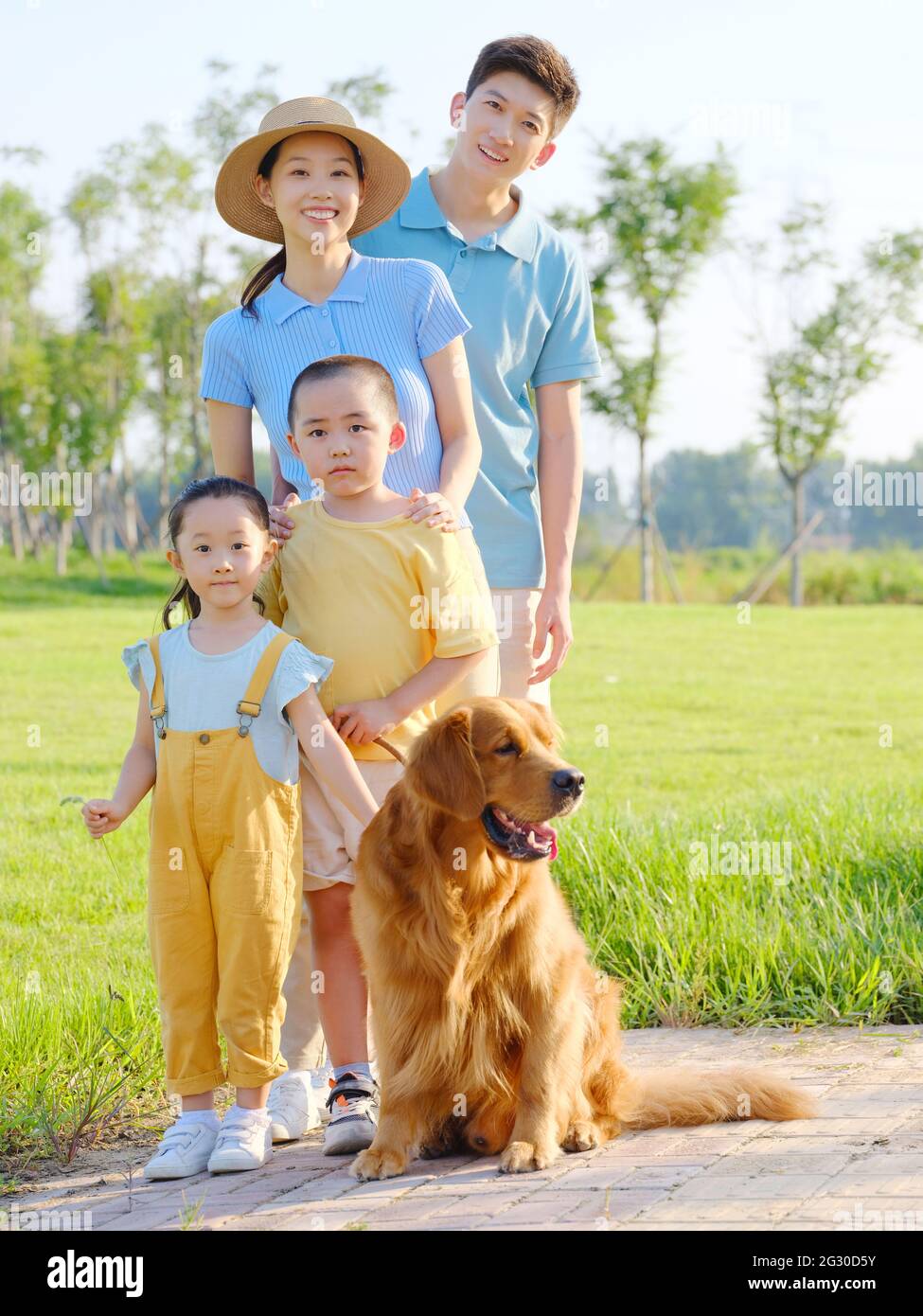 Happy family of four and pet dog in the park high quality photo Stock ...
