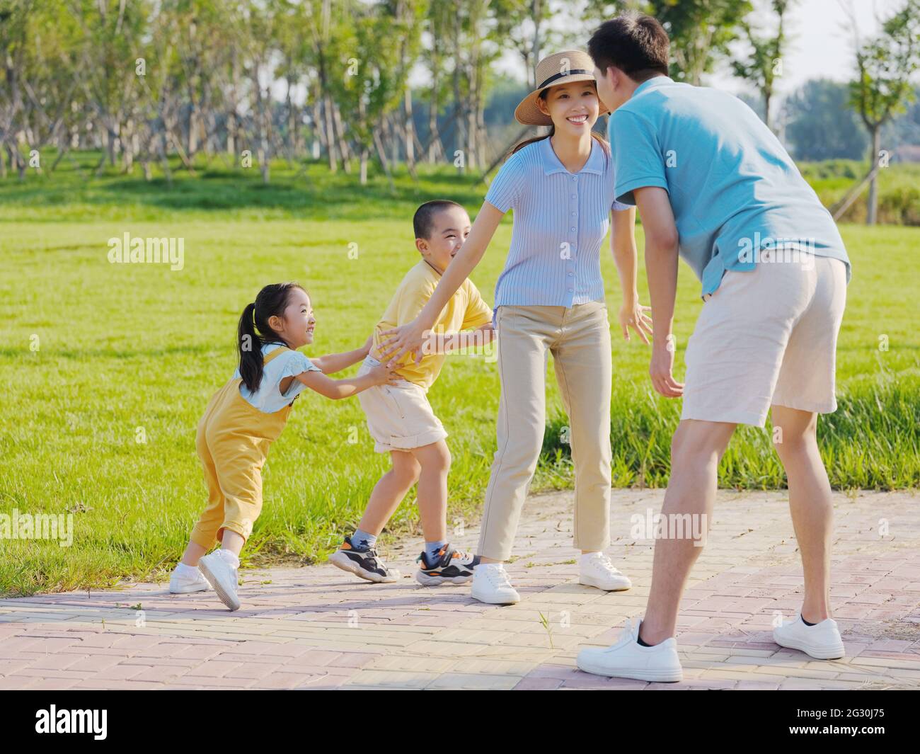 Happy family of four playing games in the park high quality photo Stock ...